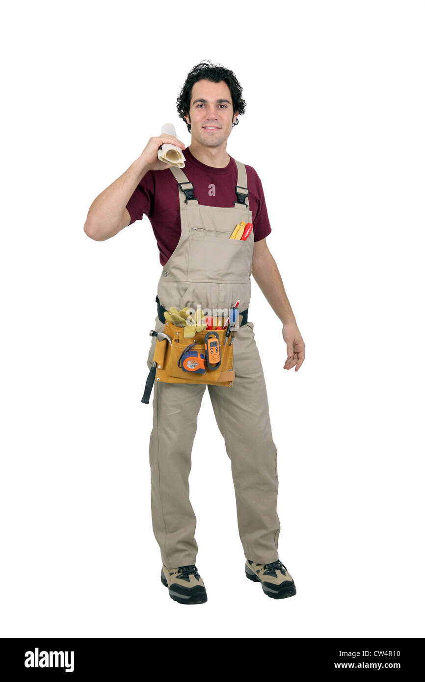 Decorator holding roll of wallpaper Stock Photo - Alamy