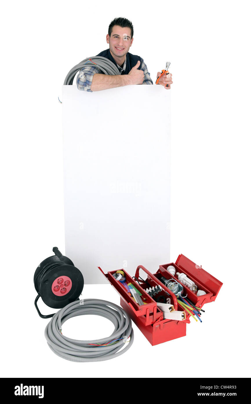 Laborer standing behind white sign for message Stock Photo - Alamy