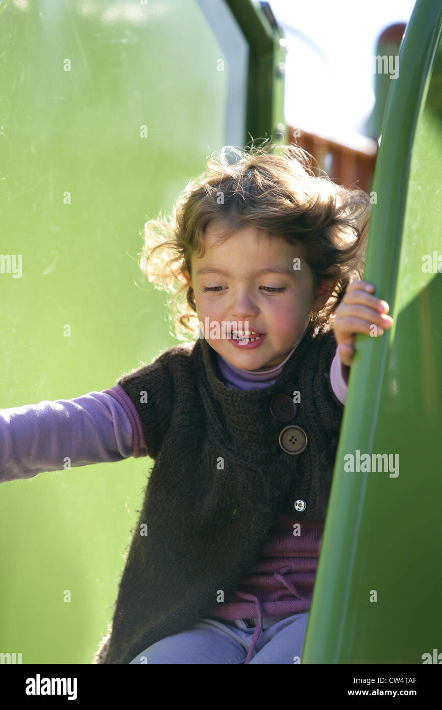 Girl on a slide Stock Photo - Alamy
