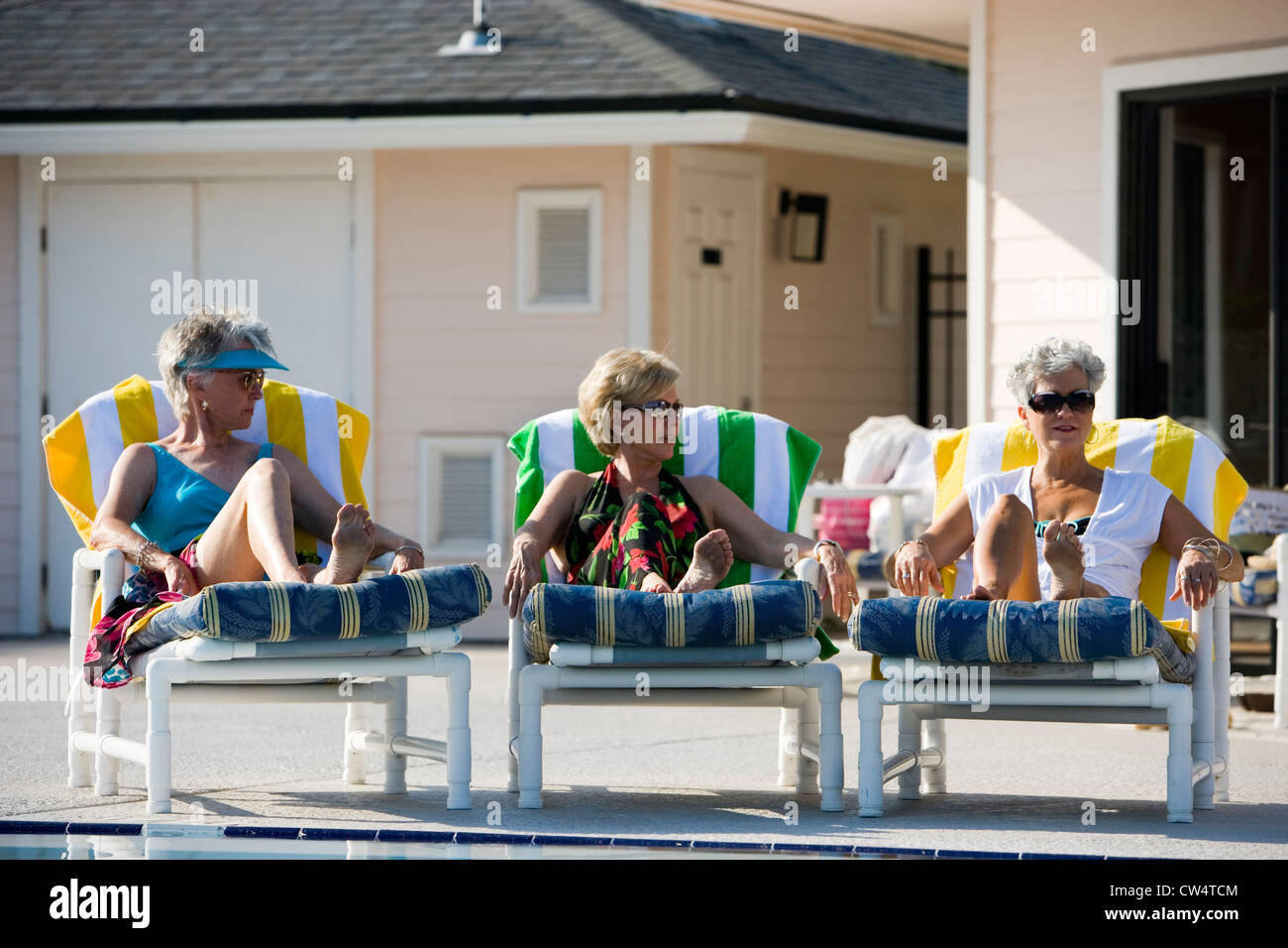 Senior women relaxing on reclining chair Stock Photo - Alamy