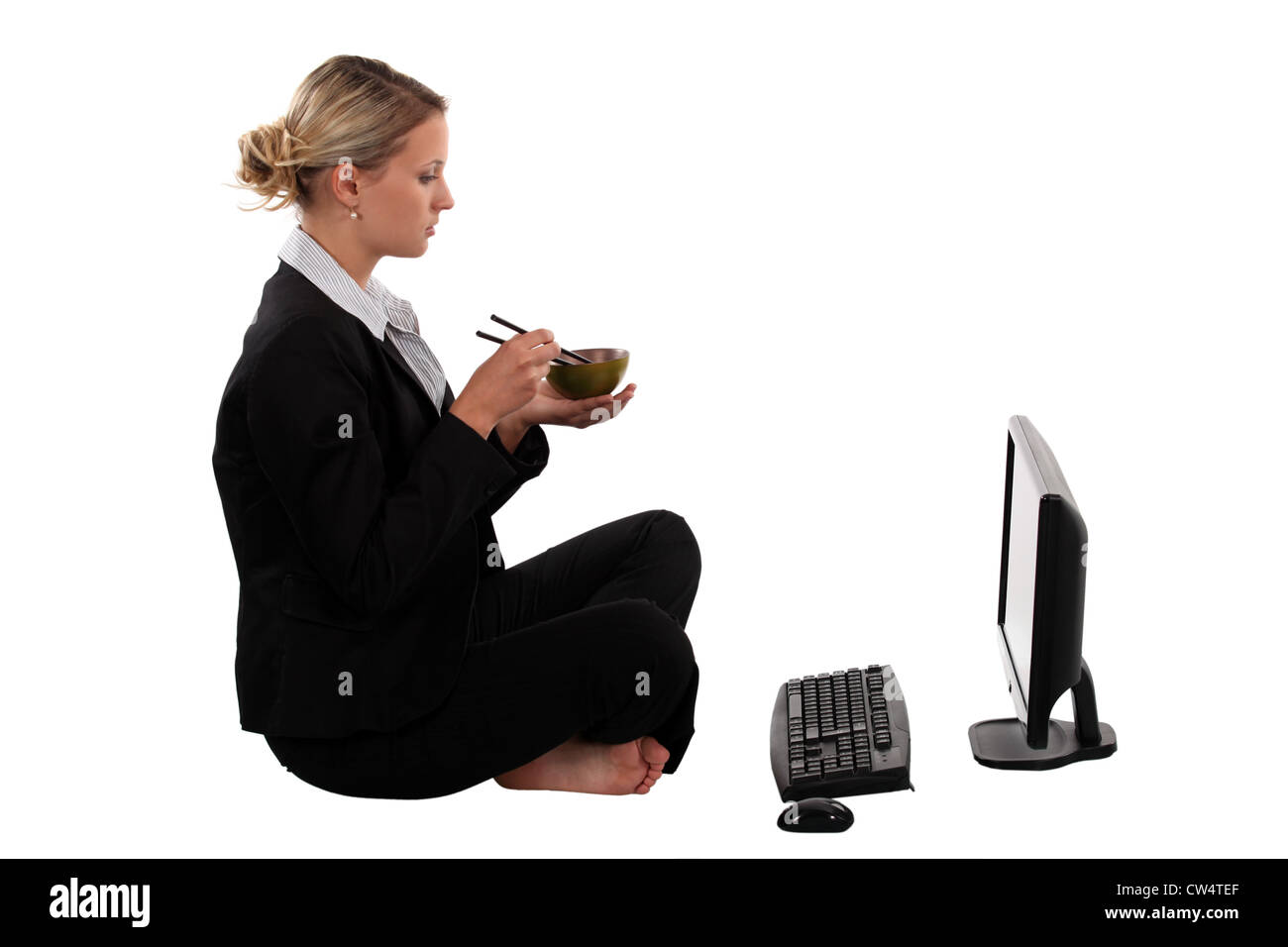 Blond office worker sat eating Chinese food Stock Photo - Alamy