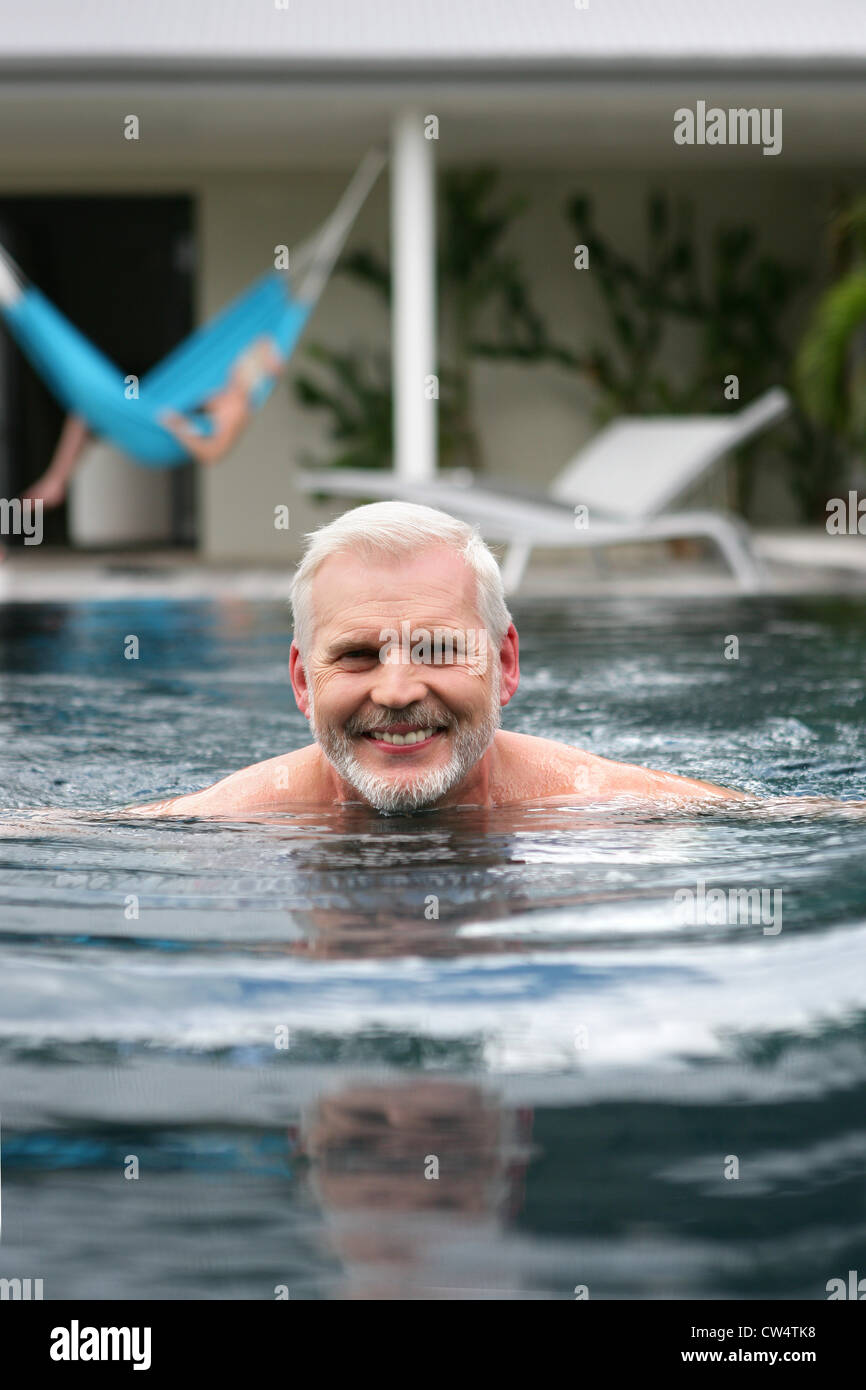 Senior man in a swimming pool Stock Photo - Alamy