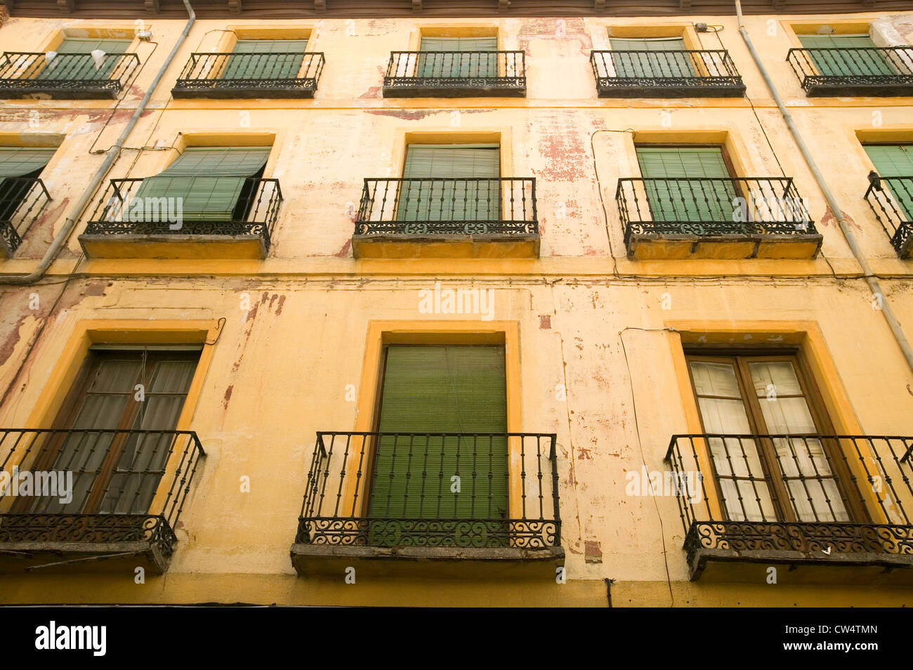 Green window shades of building in Avila Spain, an old Castilian ...