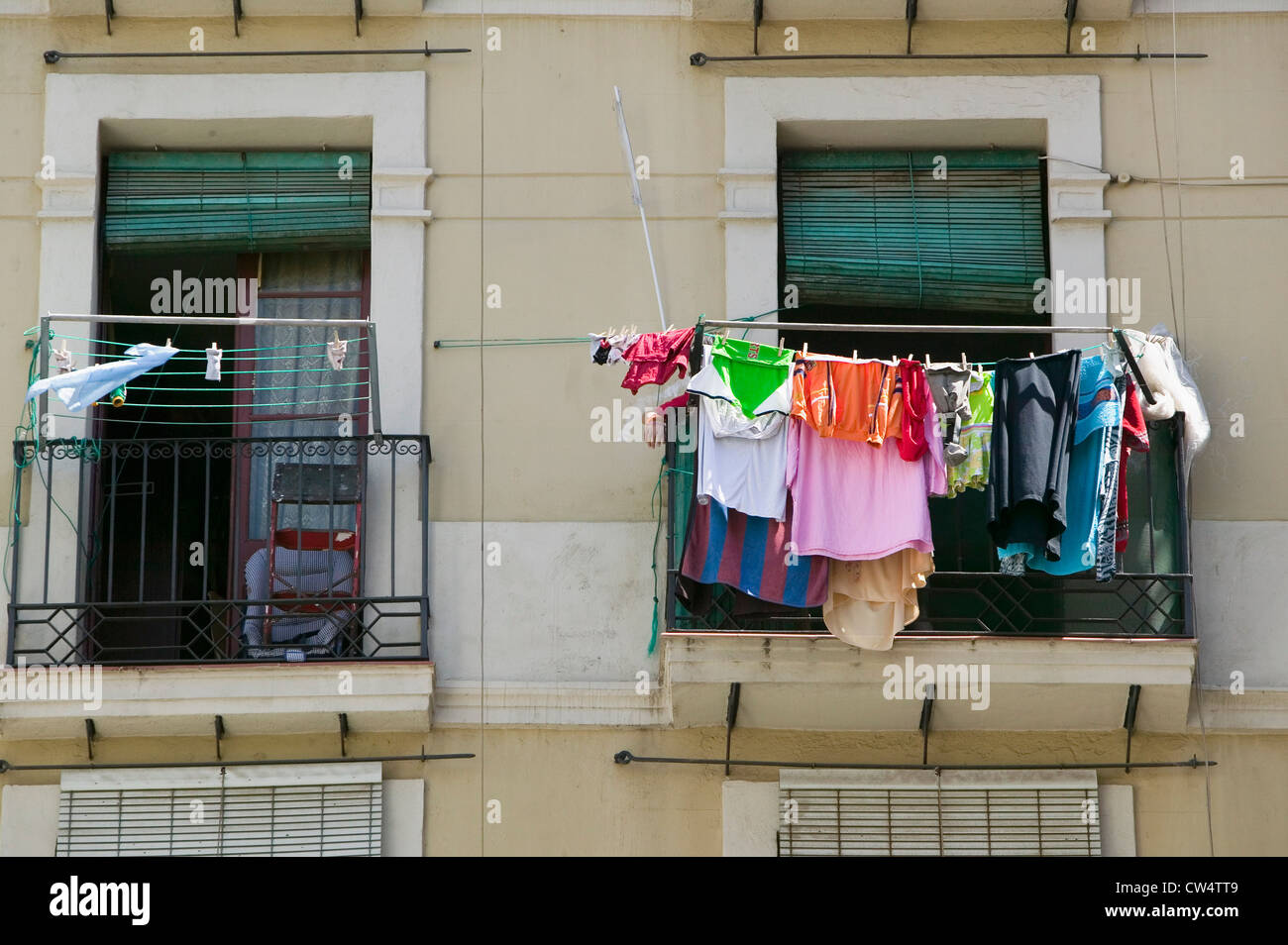 Laundry hangs in window of old section of Barcelona, Spain Stock Photo ...