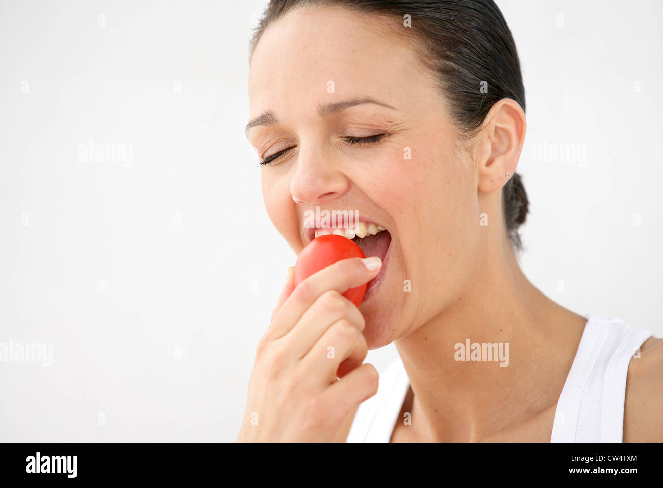 Girl taking bite apple apple hi-res stock photography and images - Alamy