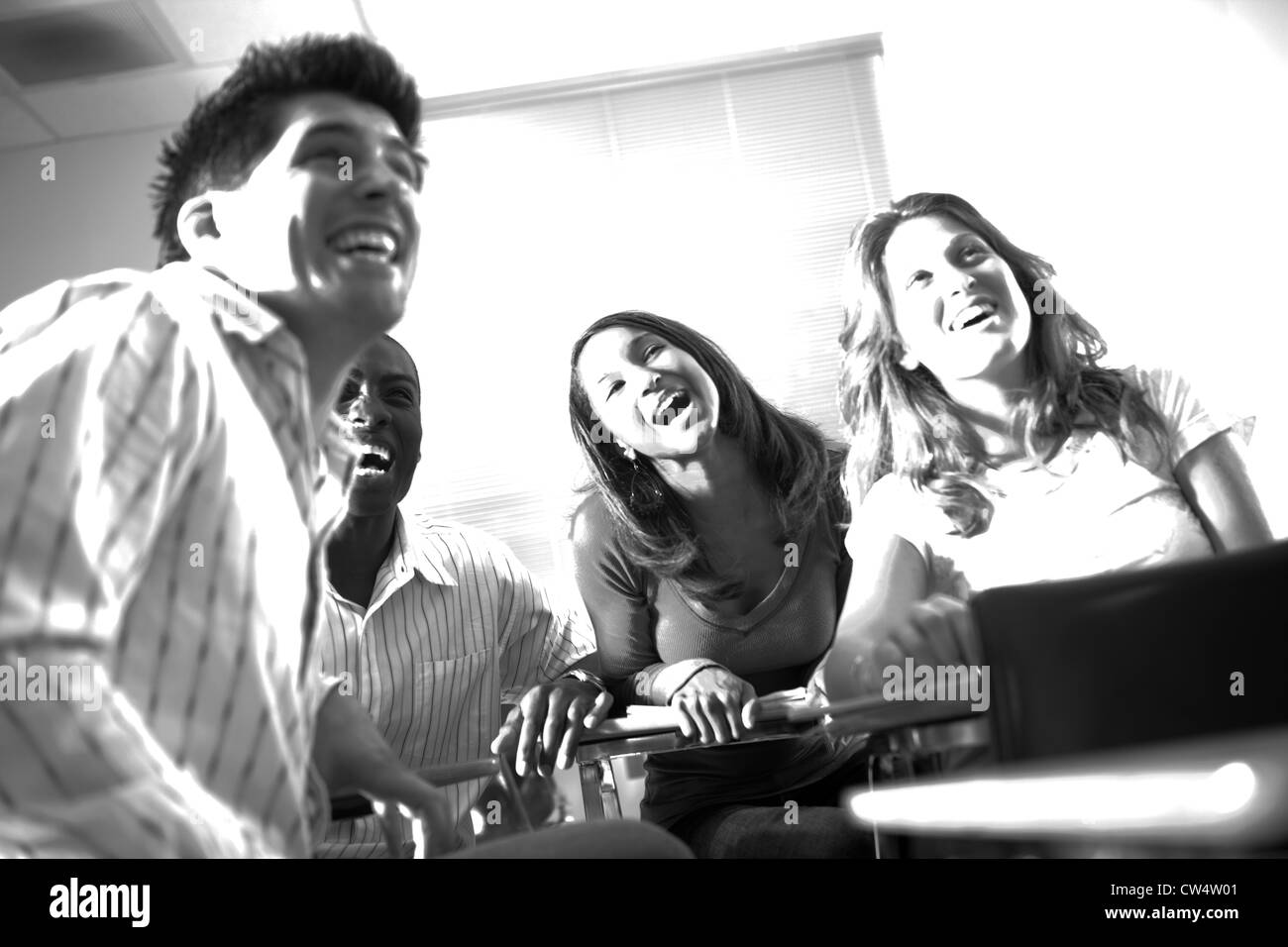 University students attending lecture in the classroom and smiling ...