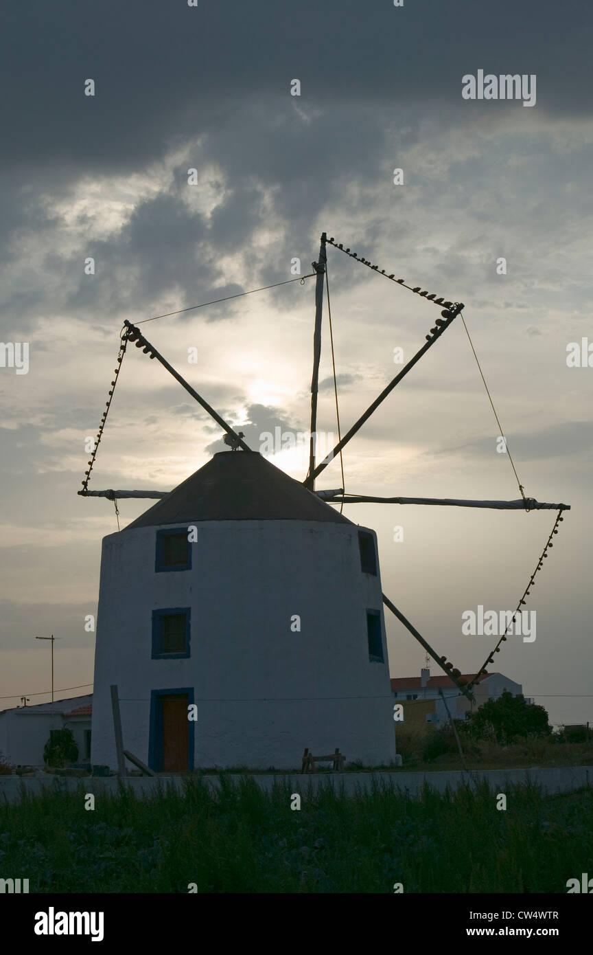 Ancient windmill in Portugal at sunset Stock Photo - Alamy