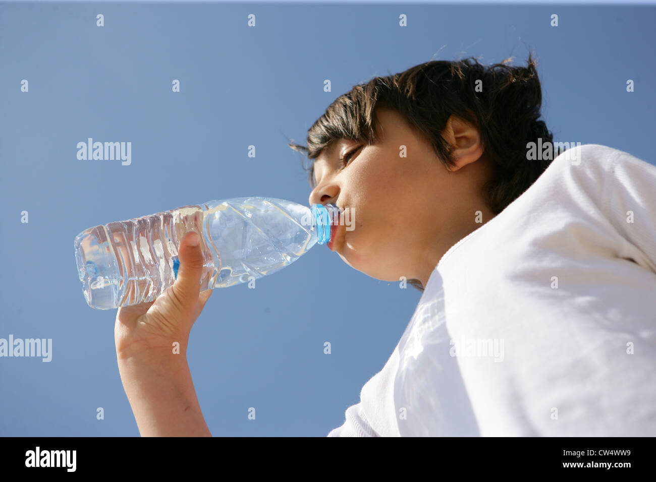 Drinking a bottle of refreshing water Stock Photo - Alamy