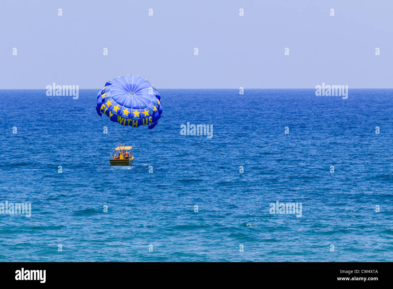 A crew in Crete/Greece preparing customers for parasailing Stock Photo ...