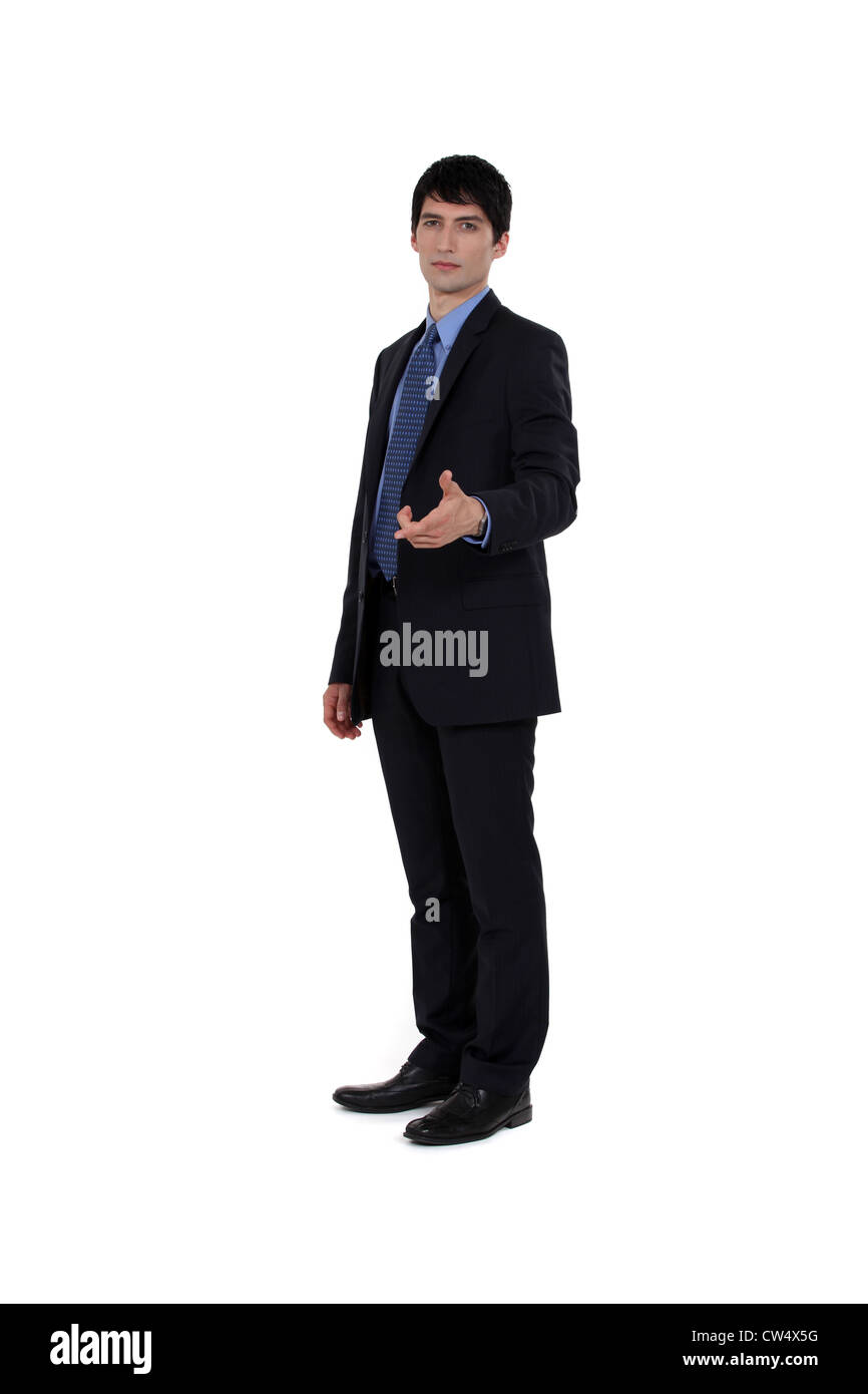 handsome businessman shaking hands with someone Stock Photo - Alamy