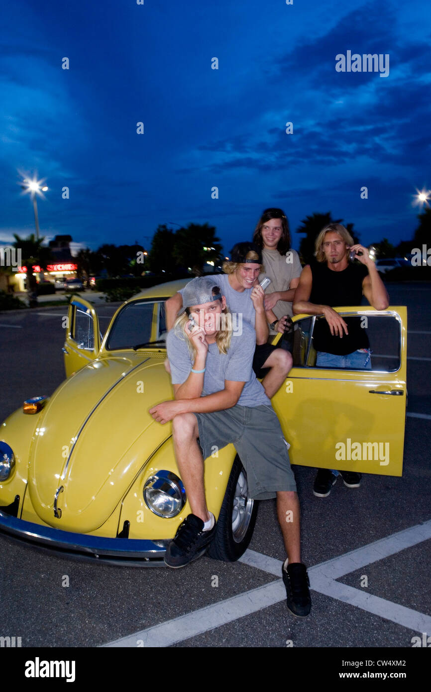 Friends using each phone on the car hi-res stock photography and images ...