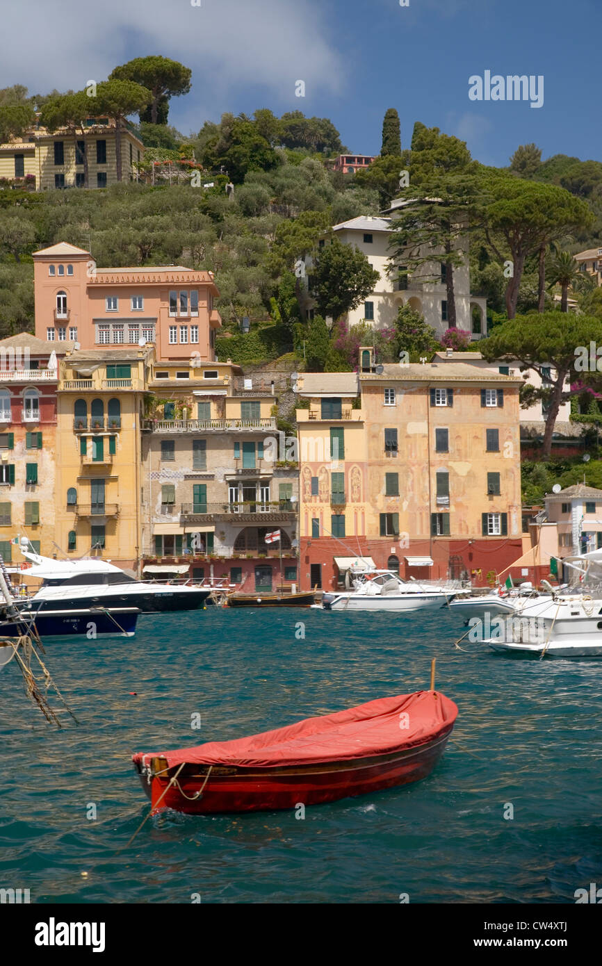 Red boat in Portofino's Riviera di Levante and its colorful buildings ...