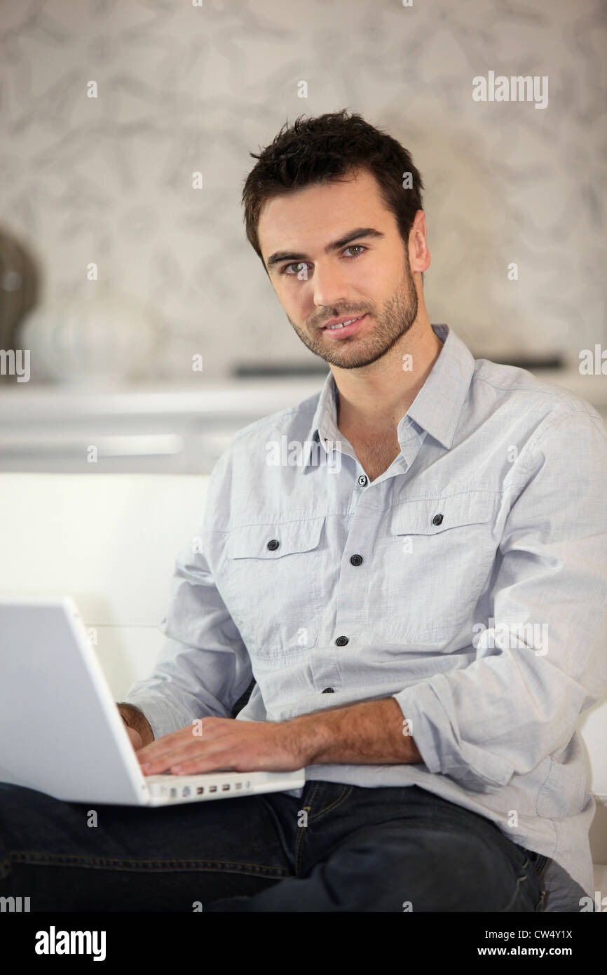 man working on his laptop Stock Photo - Alamy
