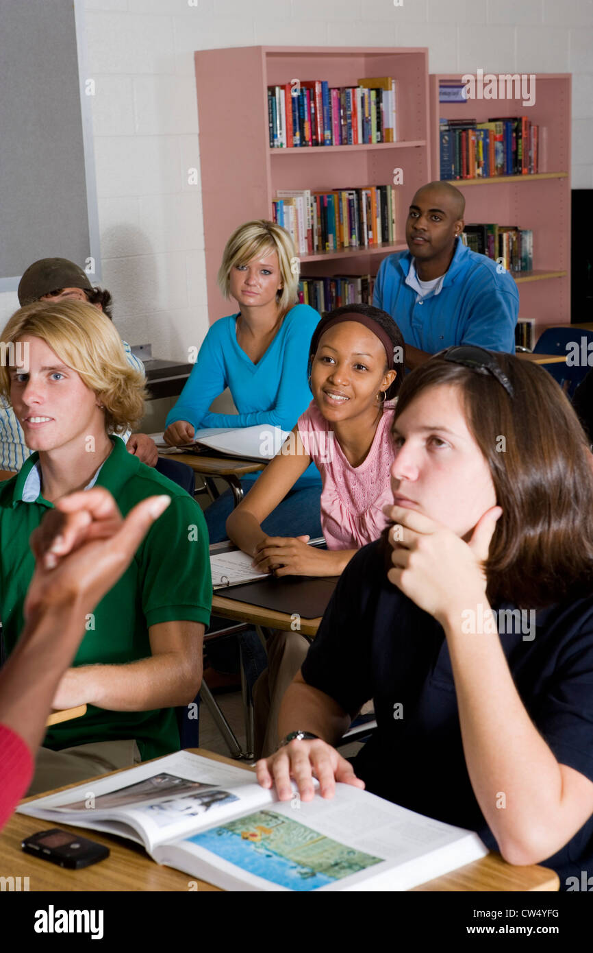 Students sitting and listening in the classroom Stock Photo - Alamy