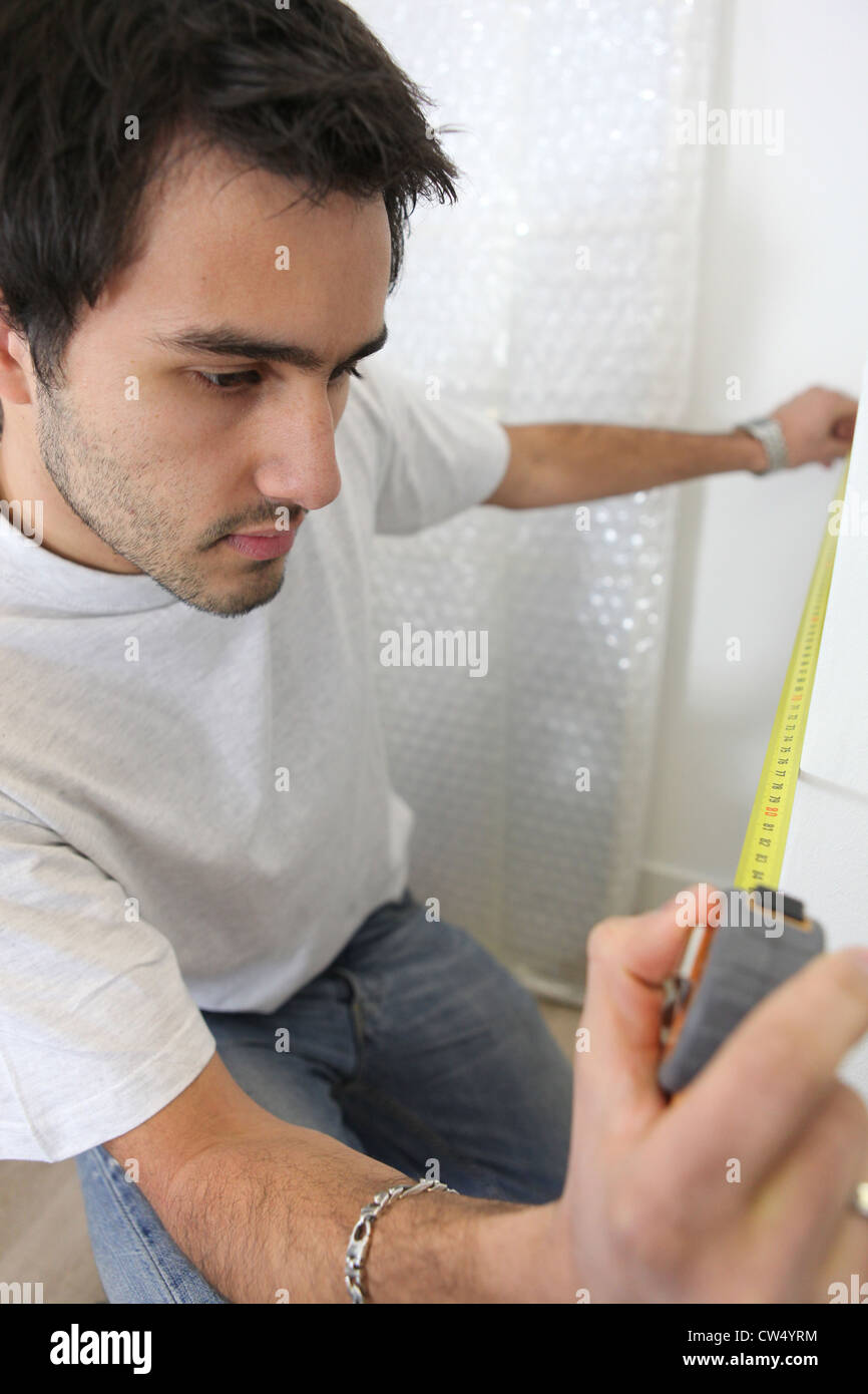 Man taking measurements Stock Photo - Alamy