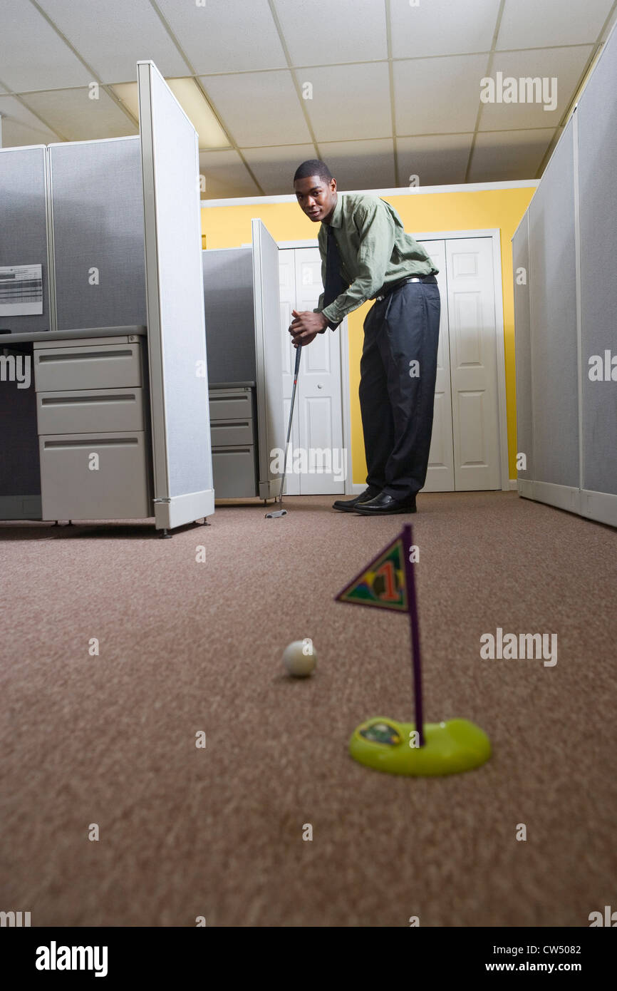 Business executive playing golf hi-res stock photography and images - Alamy