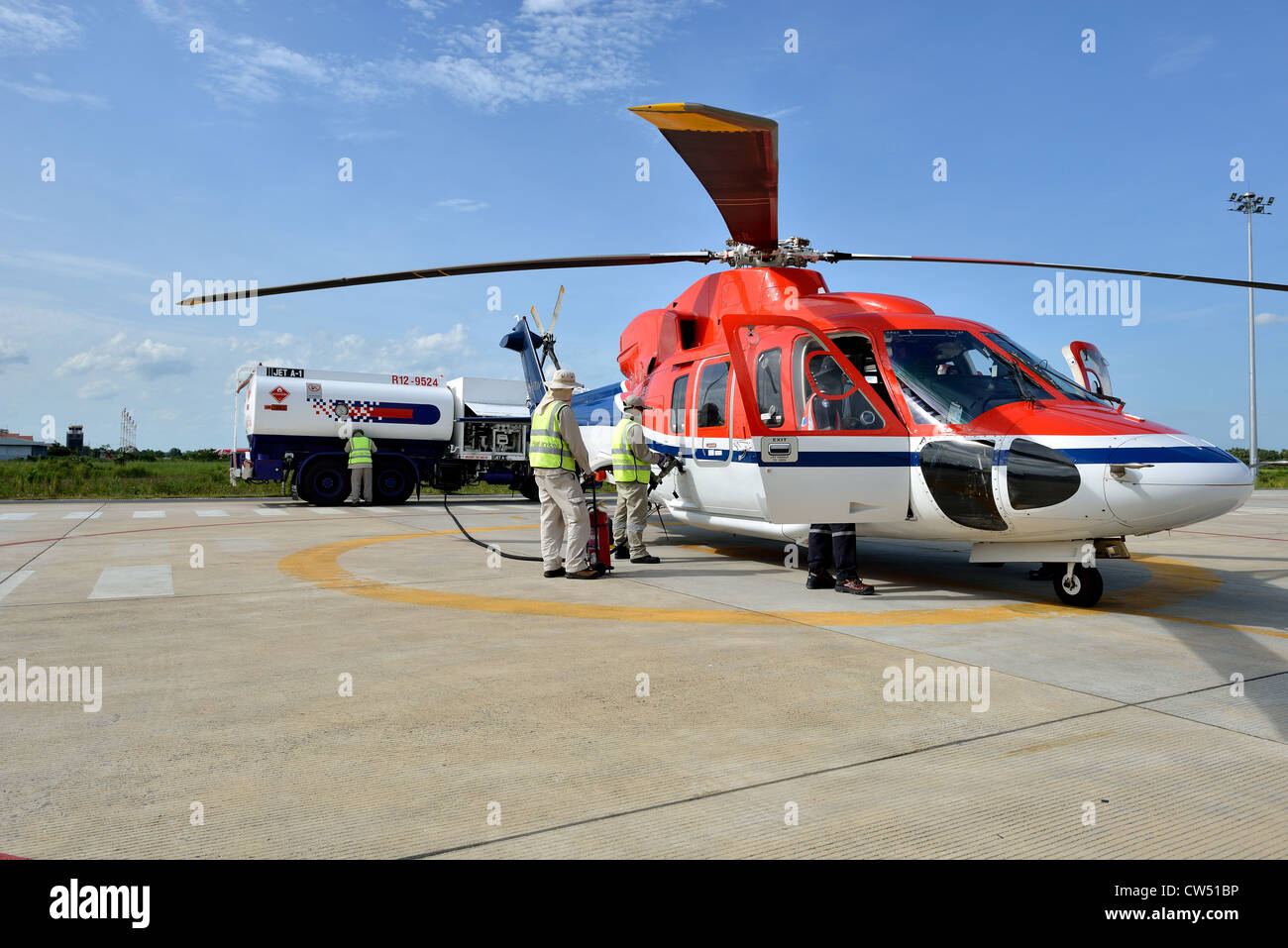They is refuelling helicopter at the apron Stock Photo - Alamy
