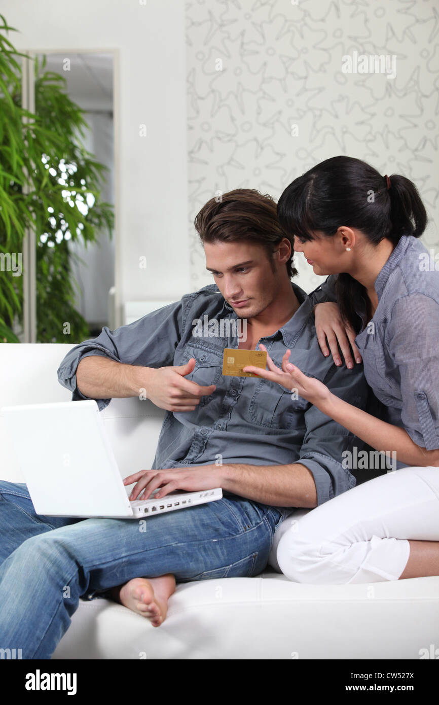 Couple shopping online Stock Photo - Alamy