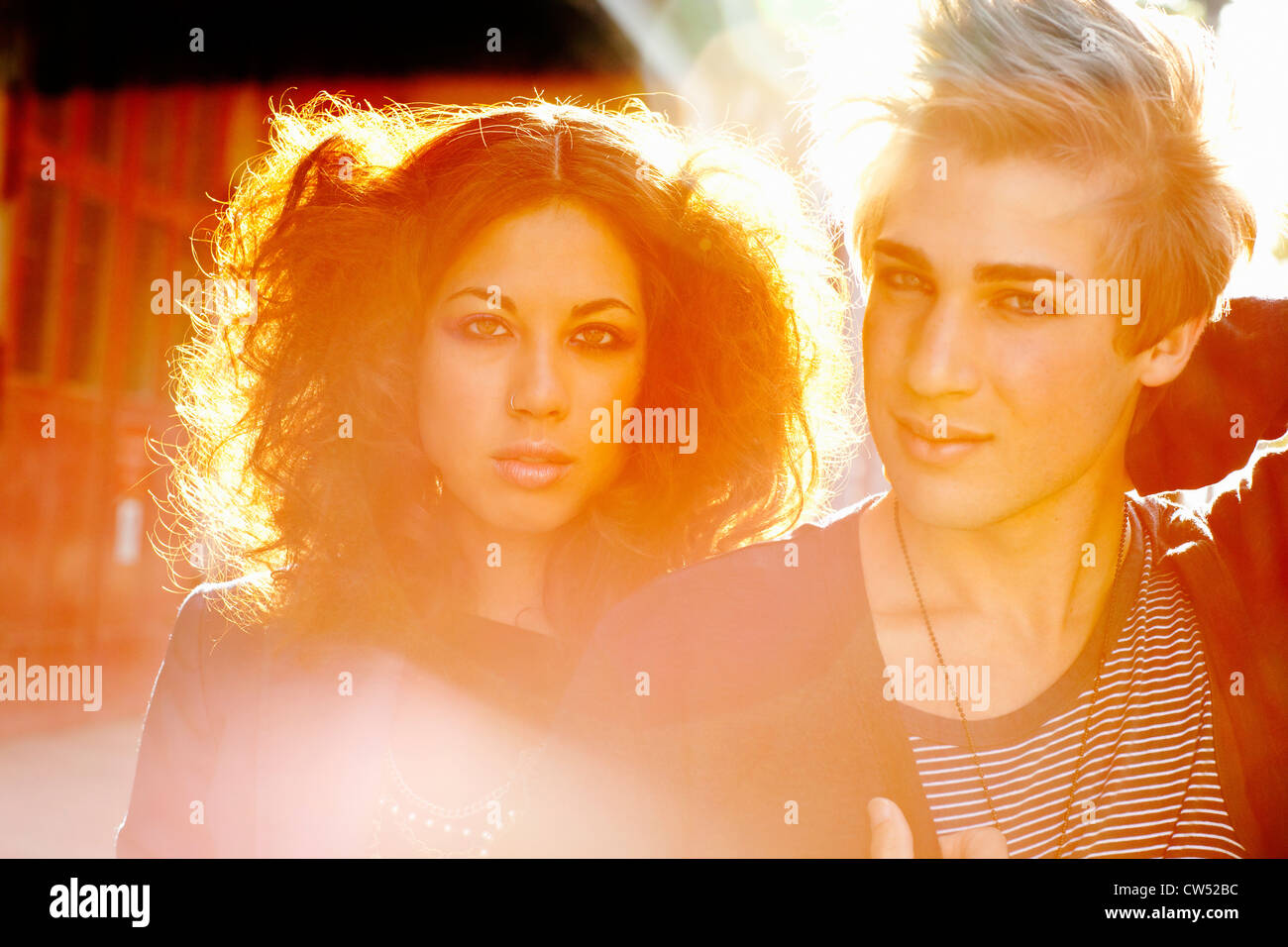 Portrait of couple backlit by sun Stock Photo - Alamy