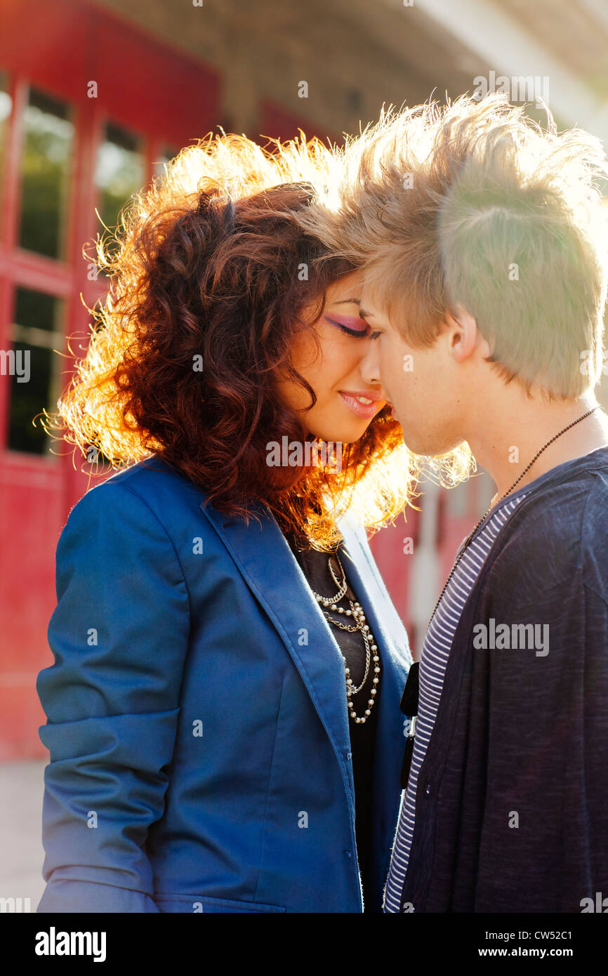 Couple embracing, almost kissing Stock Photo - Alamy