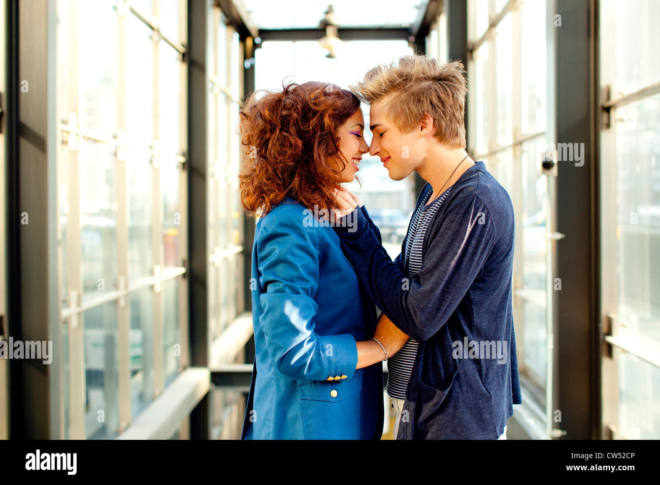 Couple embracing, almost kissing Stock Photo - Alamy