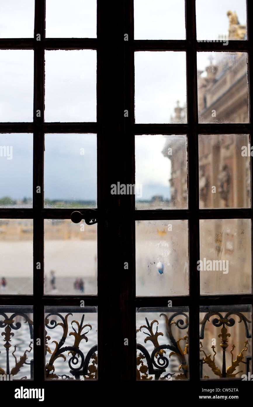 Tourists viewed through the window of a palace, Chateau De Versailles ...