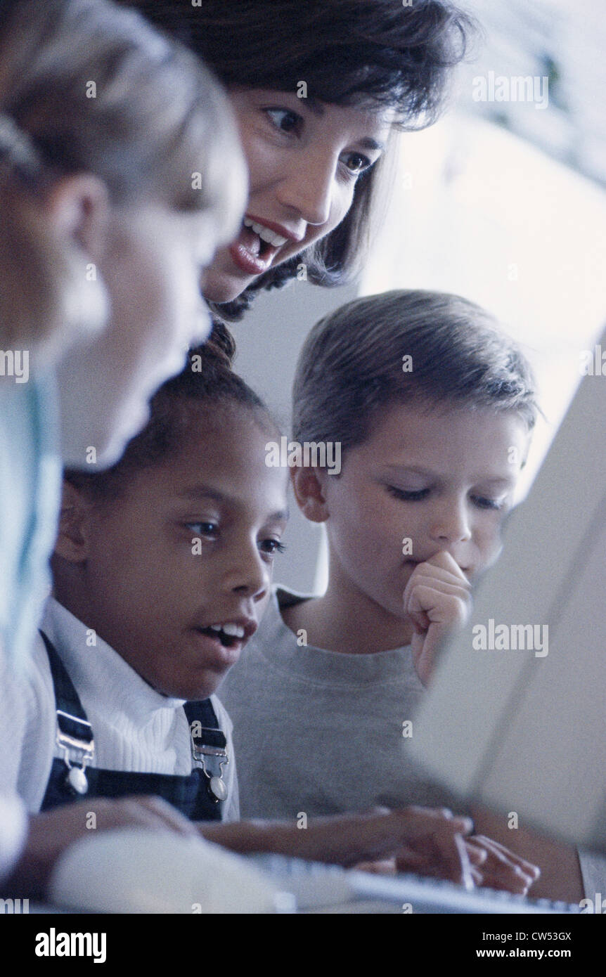 Side profile of a female teacher teaching her students Stock Photo - Alamy