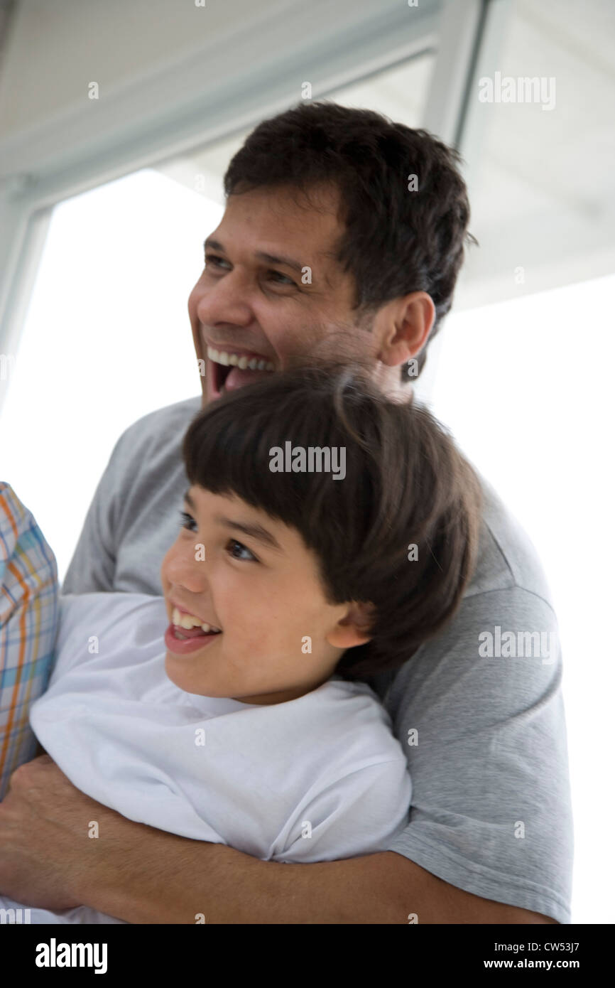 Side profile of a father and his son playing hi-res stock photography ...