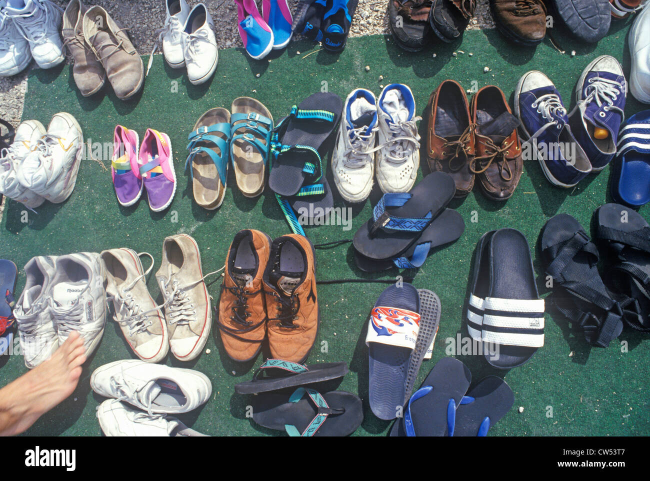 Multiple pairs of shoes on blanket Stock Photo - Alamy