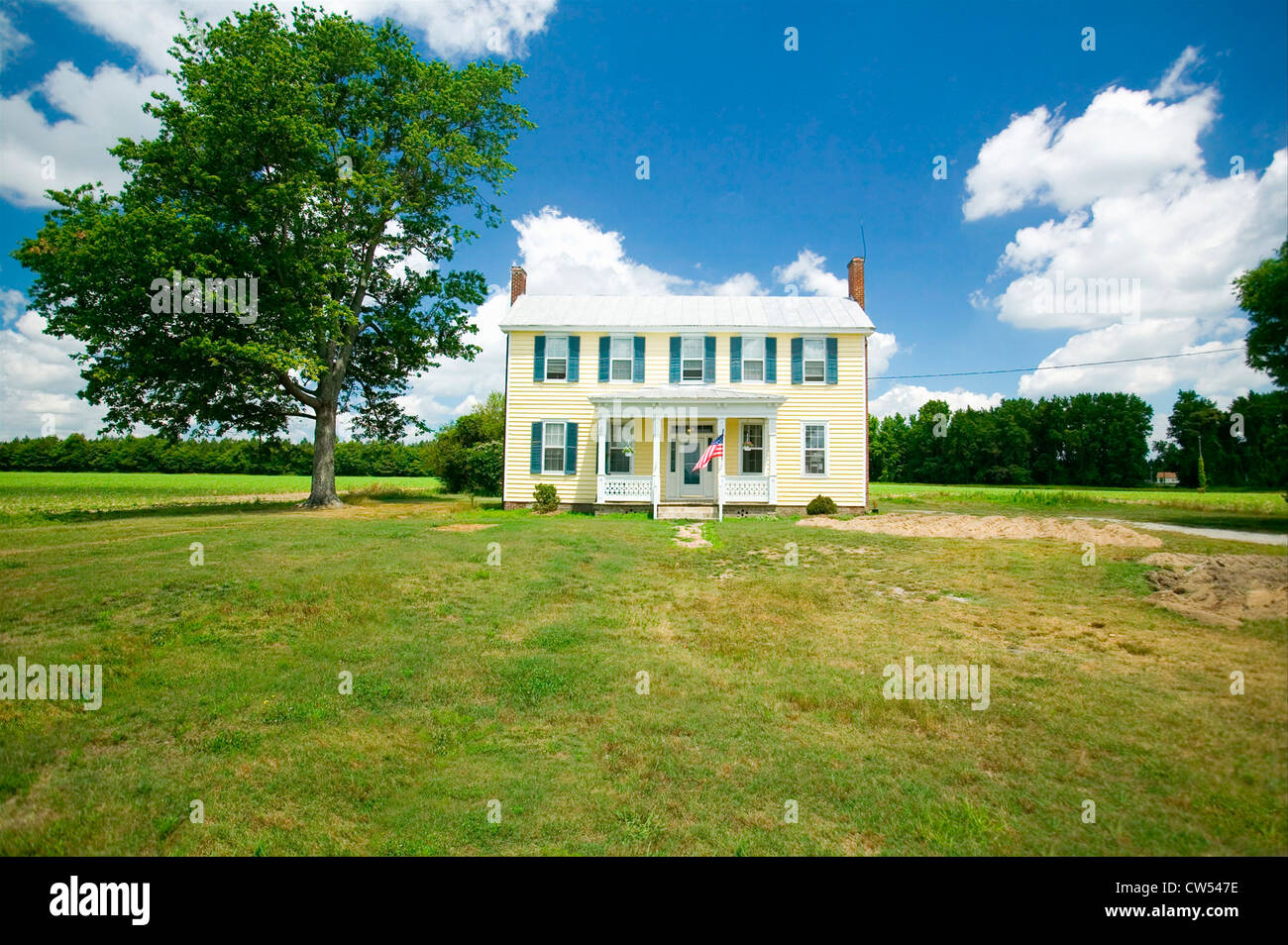 House and white puffy clouds with tree in rural Virginia Stock Photo ...