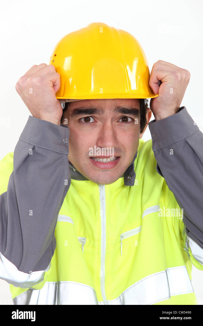 Construction worker protecting his head Stock Photo - Alamy