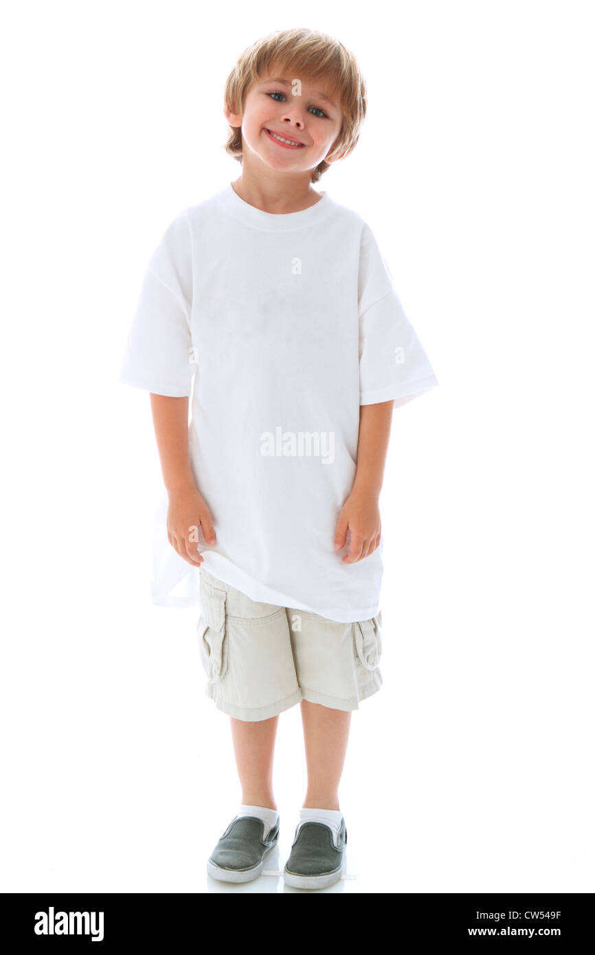 Studio shot portrait of boy standing and smiling Stock Photo - Alamy
