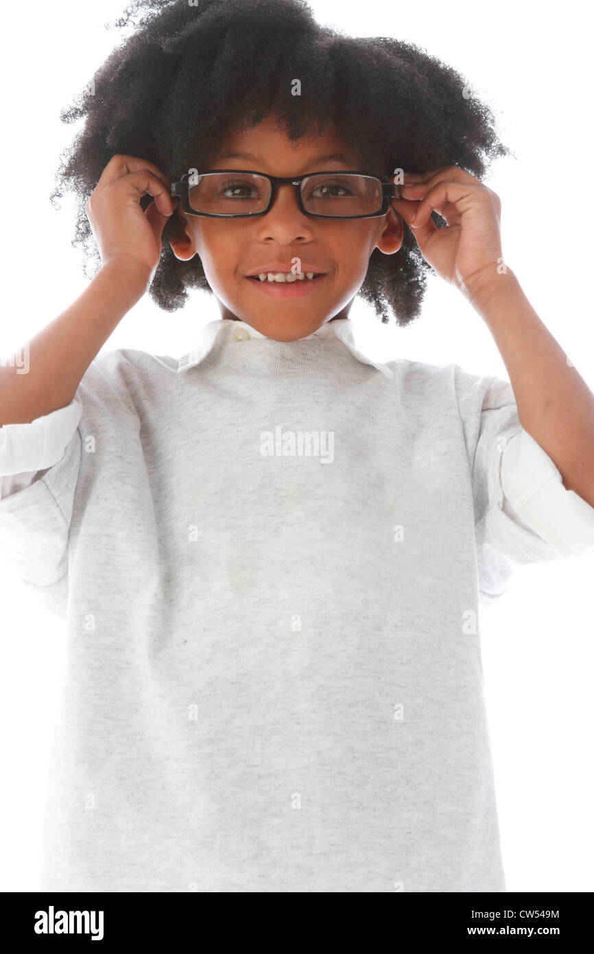 Studio shot portrait of boy with glasses smiling Stock Photo - Alamy