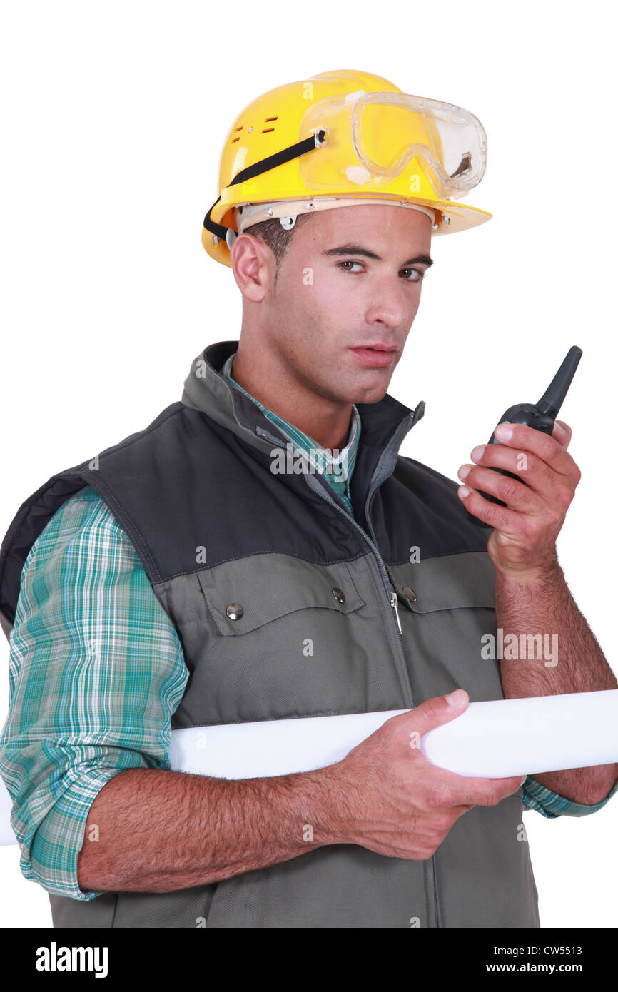 Young foreman using radio to communicate Stock Photo - Alamy