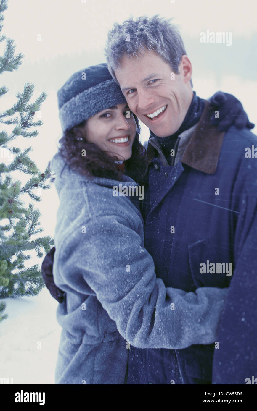 Portrait of a young couple hugging each other Stock Photo - Alamy