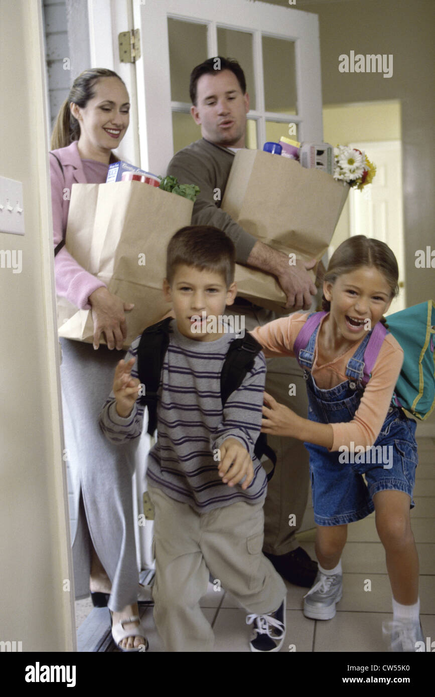 Mother father son entering hi-res stock photography and images - Alamy