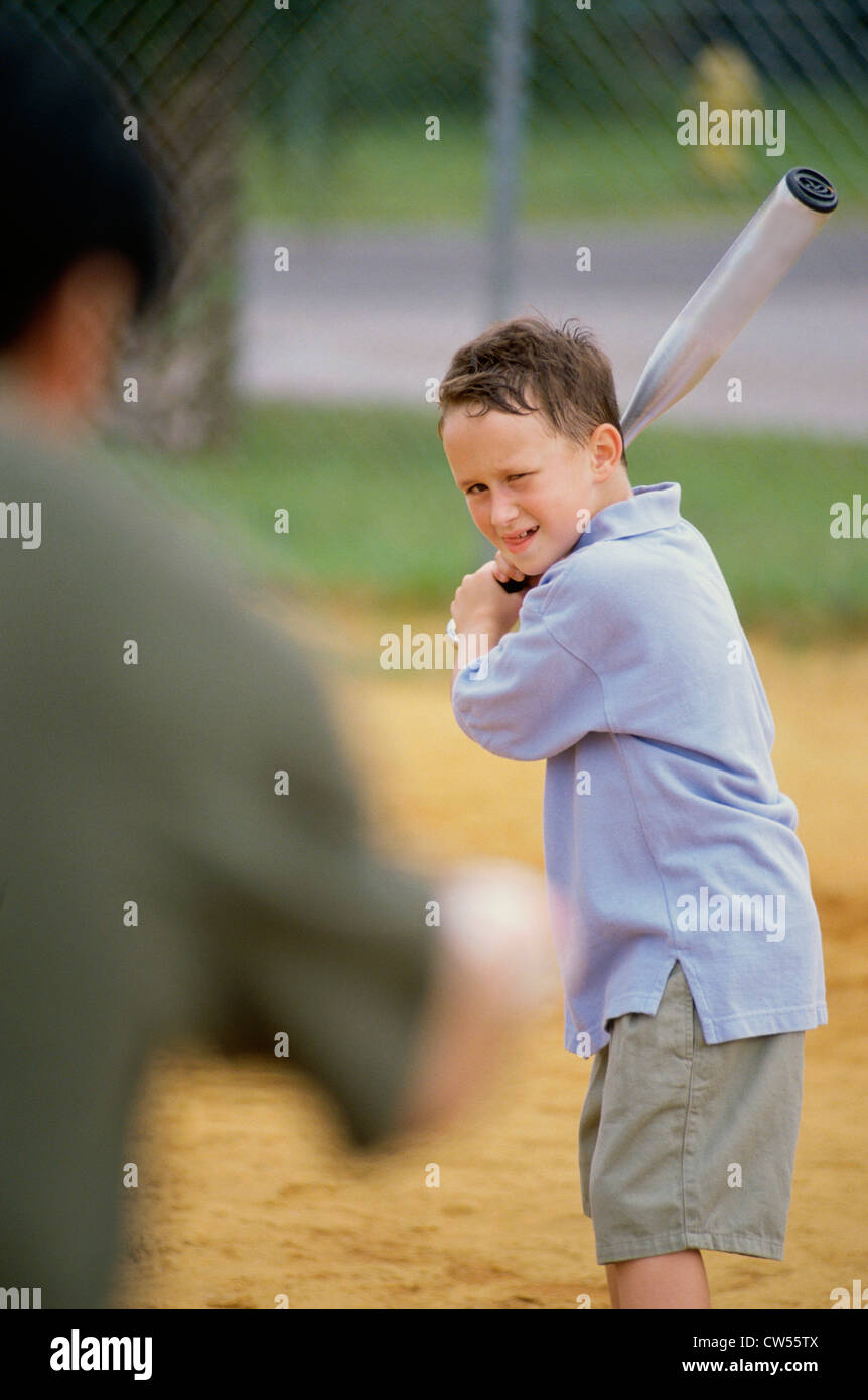 Boy playing baseball Stock Photo - Alamy