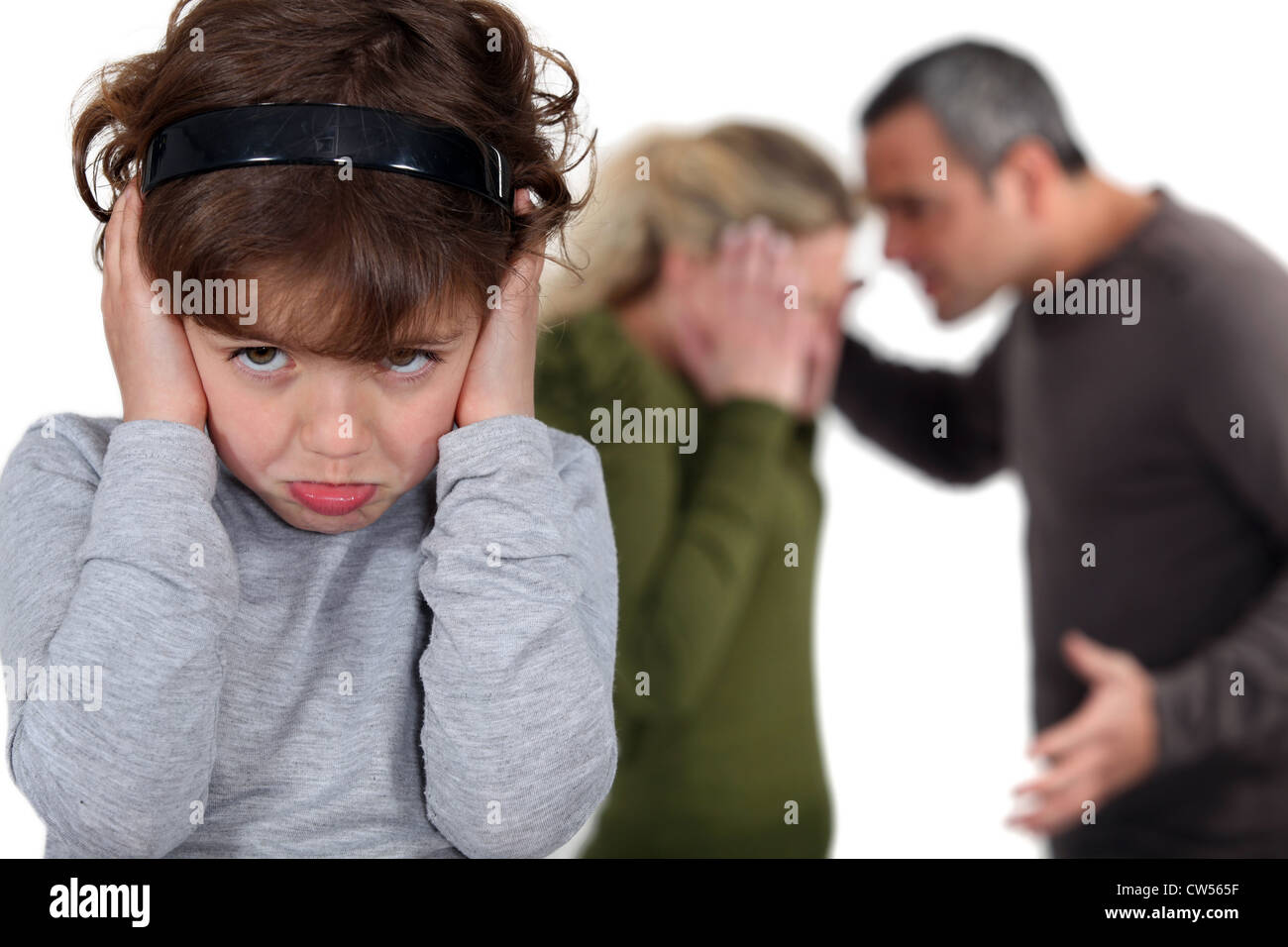 Little girl blocking out her parents' argument Stock Photo - Alamy
