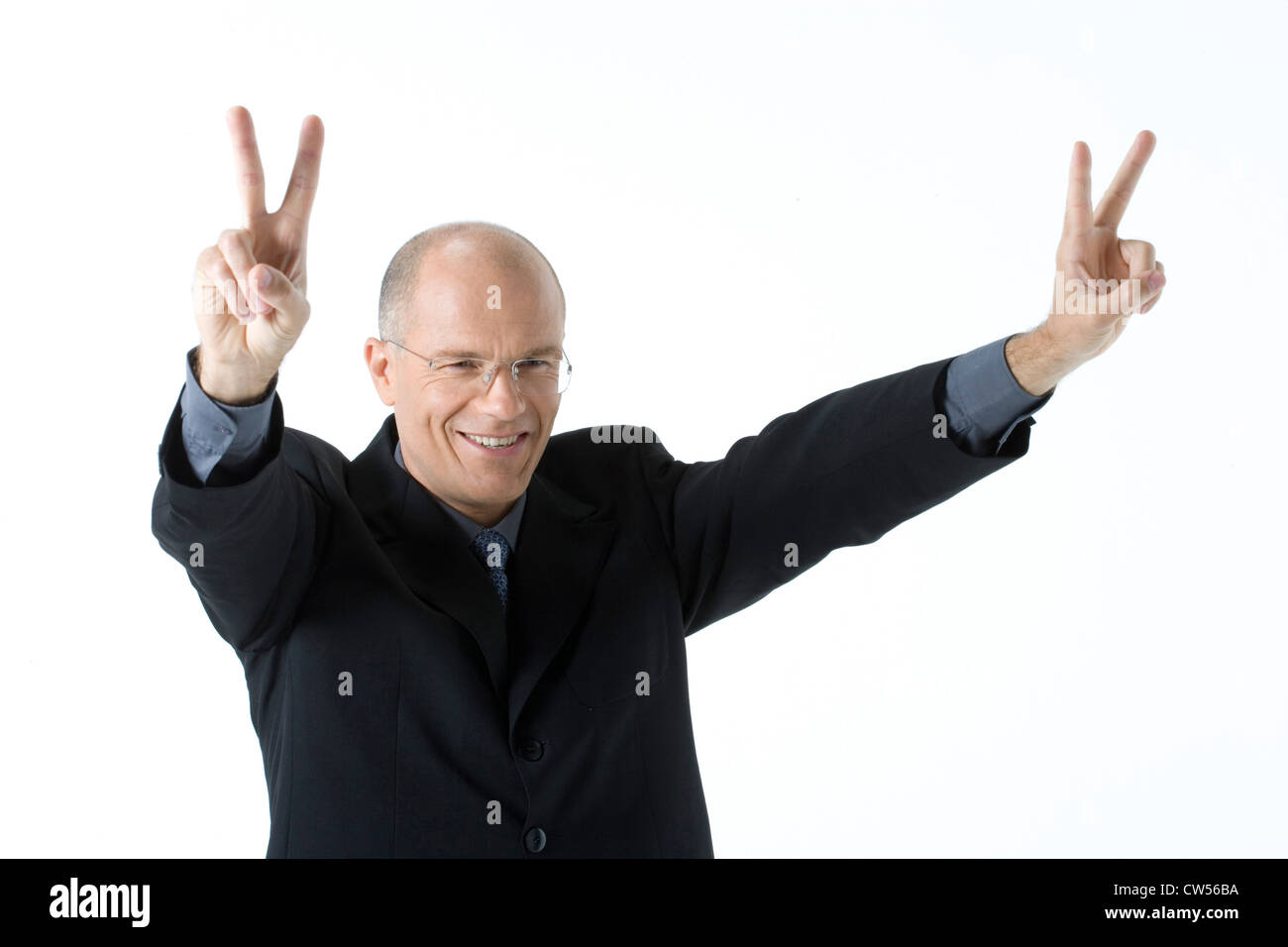 Businessman making a peace sign Stock Photo - Alamy