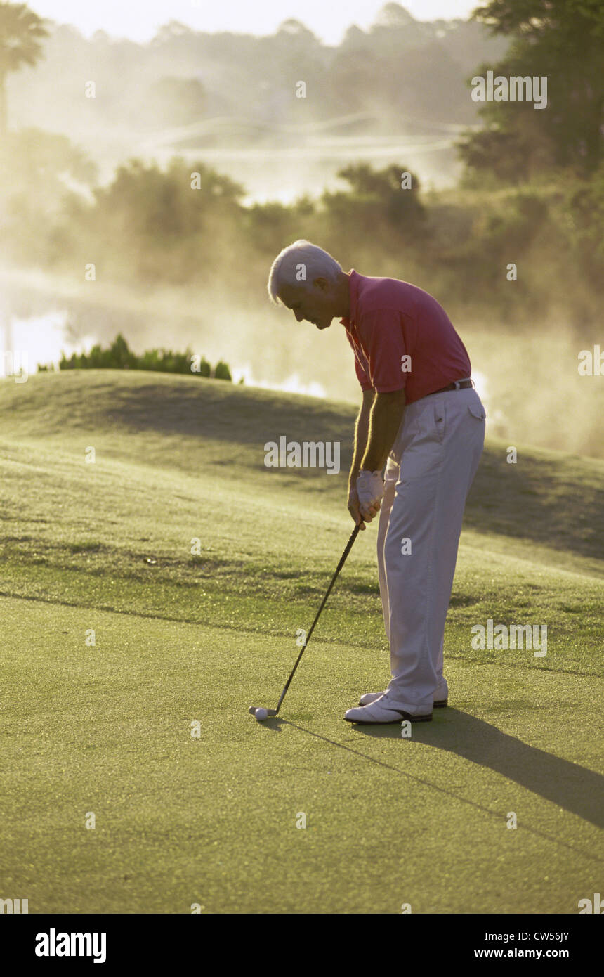 Senior man playing golf hi-res stock photography and images - Alamy