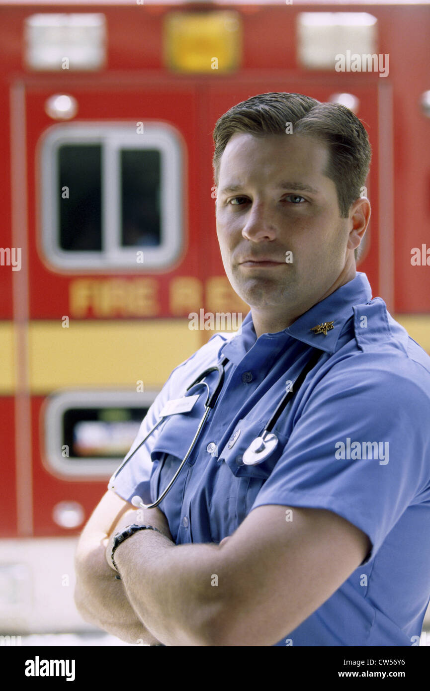 Portrait of a young paramedic standing near an ambulance Stock Photo ...