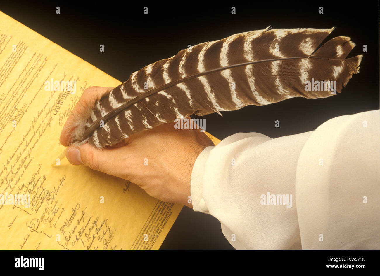 Quill pen signing a declaration Stock Photo - Alamy