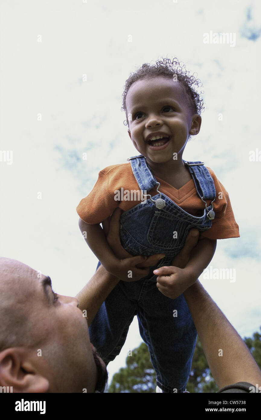 Father holding his son Stock Photo - Alamy
