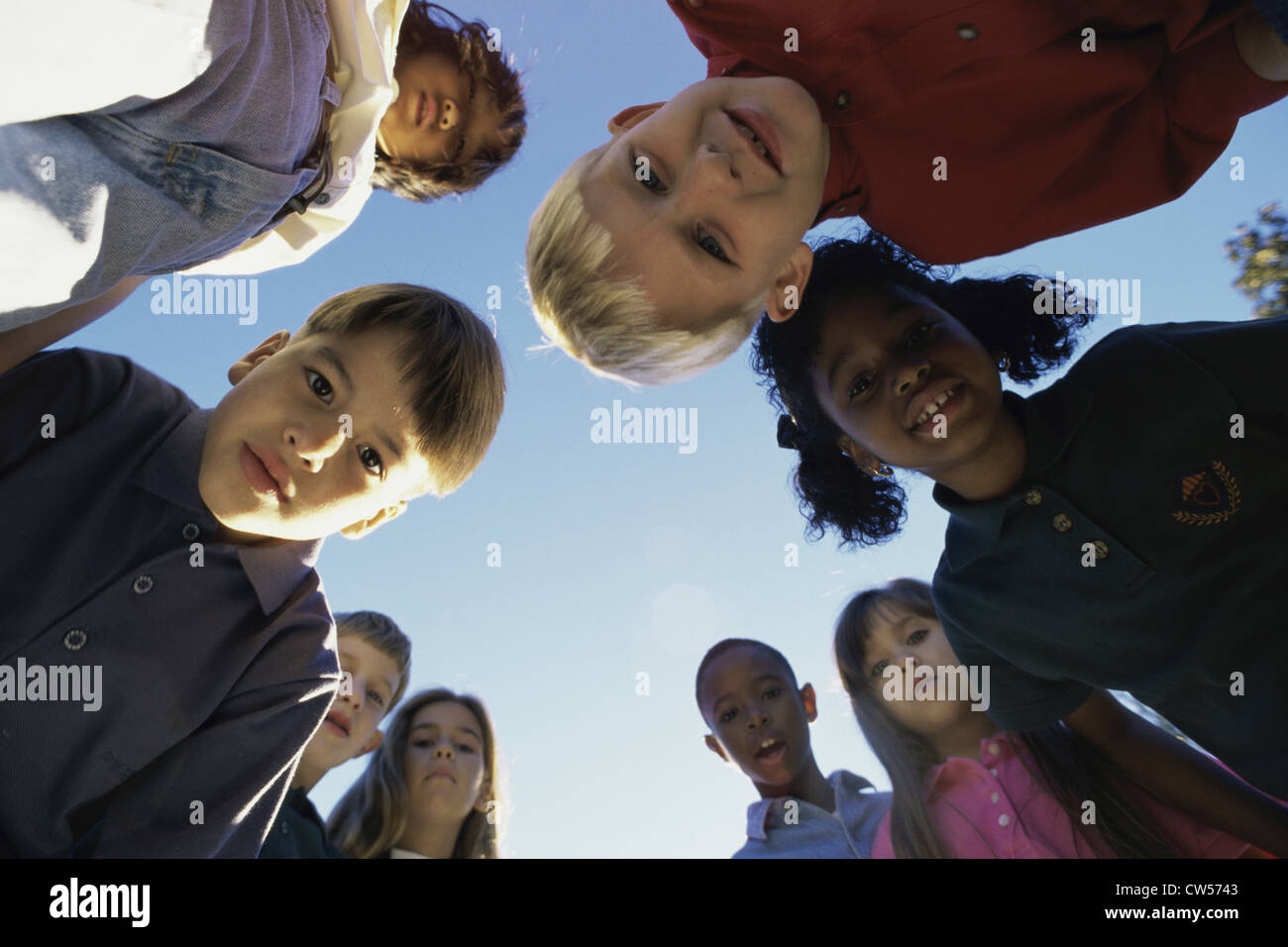 Portrait of a group of children in a huddle Stock Photo - Alamy