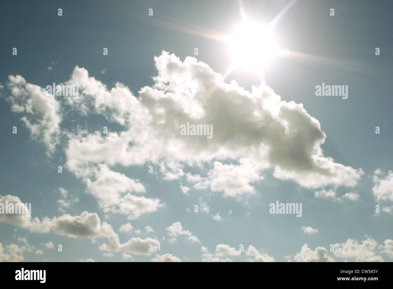 White clouds and sun in the sky Stock Photo - Alamy