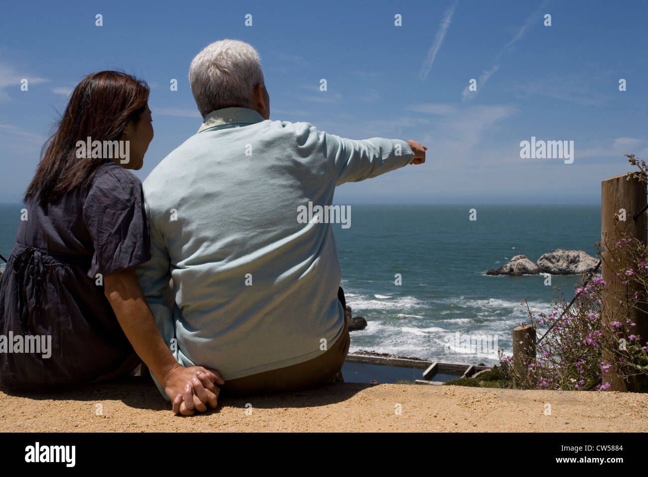 Mature women sitting beach rear view hi-res stock photography and ...