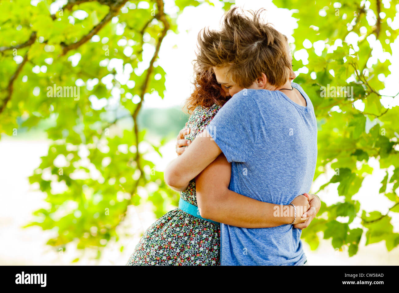 Romatic couple embracing outside Stock Photo - Alamy