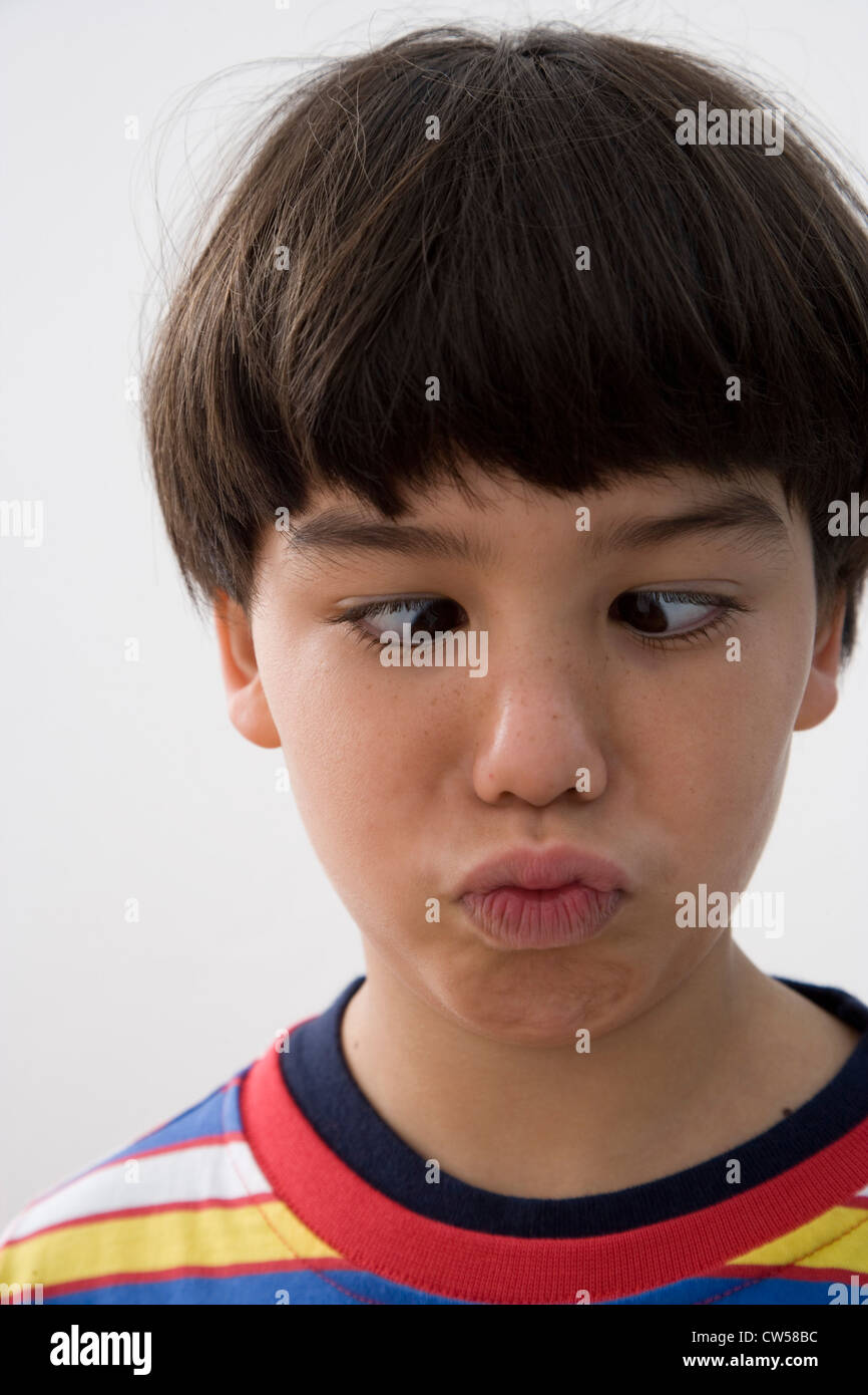 Close-up of a boy making a funny face Stock Photo - Alamy