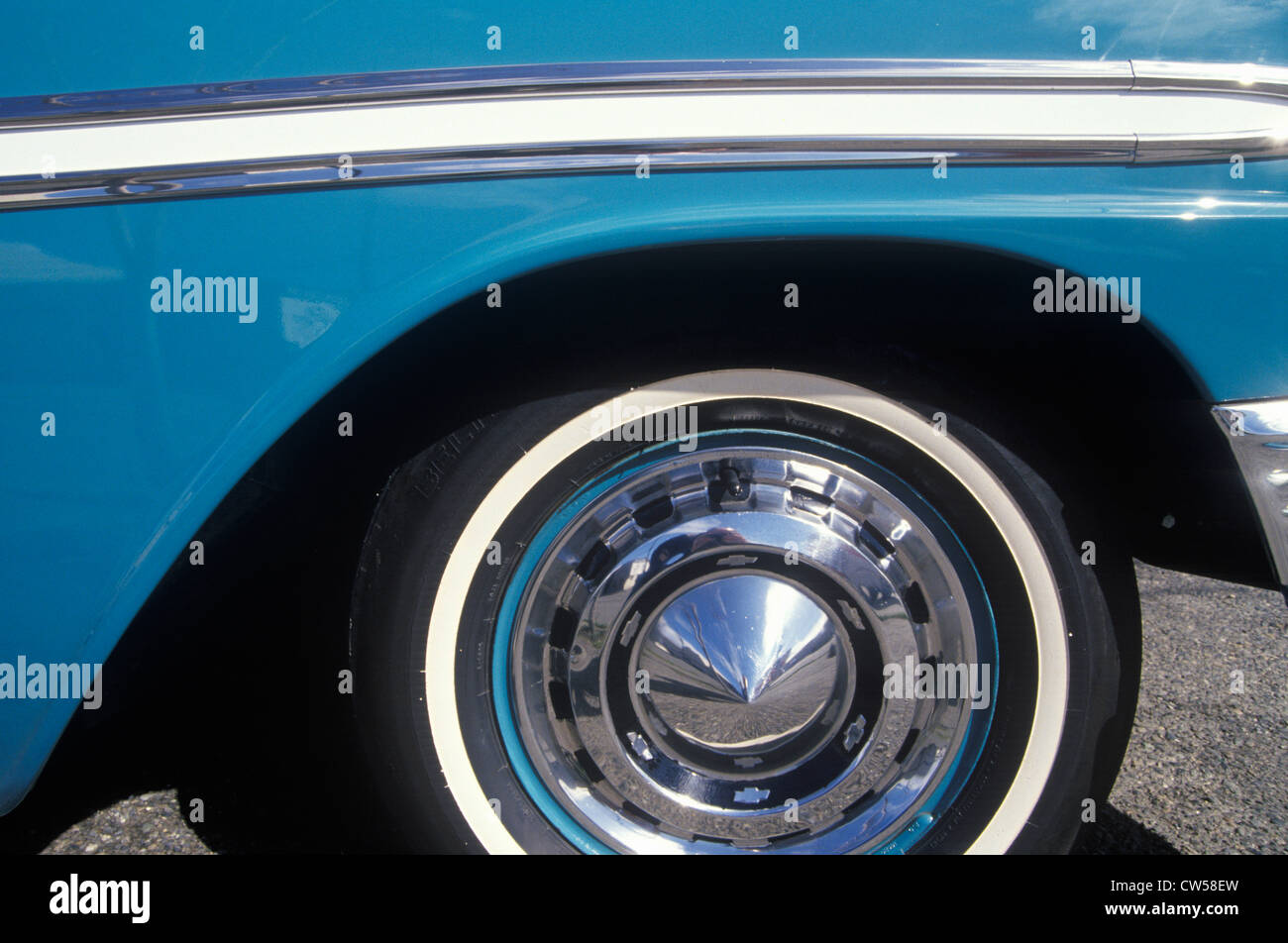 A side wheel and panel of a blue 1956 Chevrolet Stock Photo - Alamy
