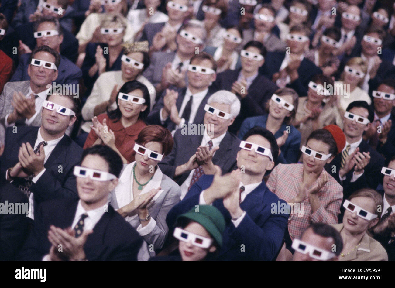 Group of people wearing 3-D glasses clapping Stock Photo - Alamy